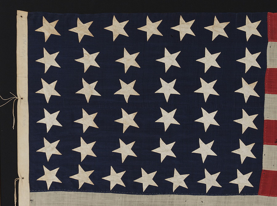 38 CANTED HAND-SEWN STARS AND HAND-SEWN STRIPES ON A FLAG IN A ...
